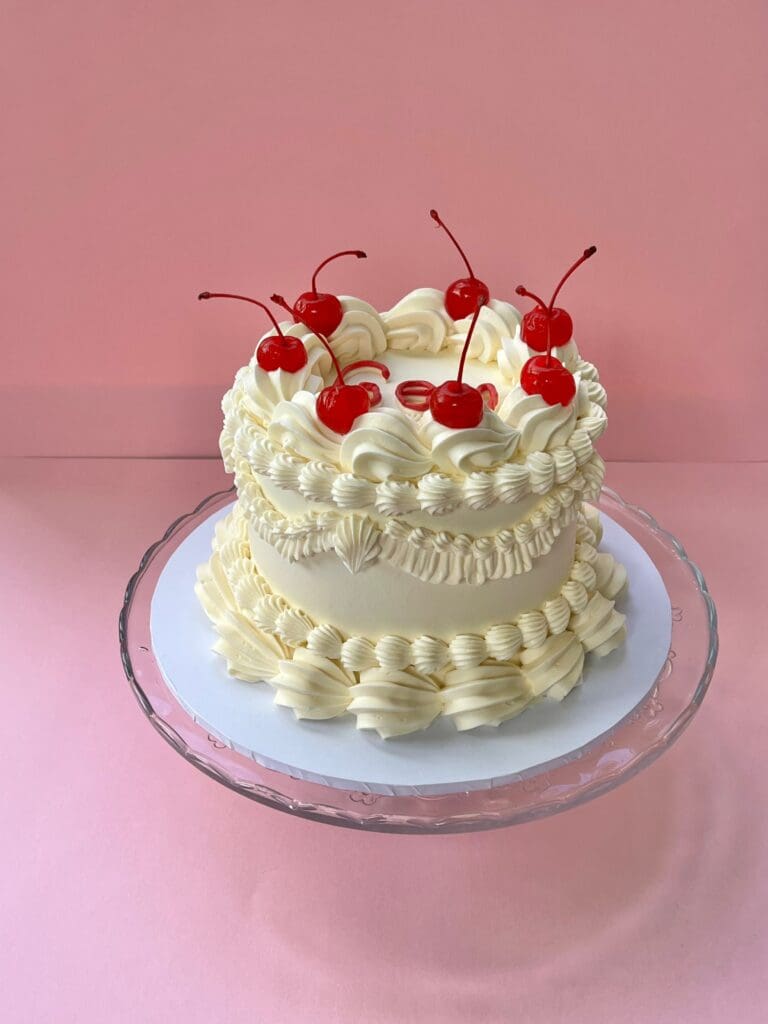 The Retro Cake Is Back: White Icing, Red Cherries & Script That Says It ...